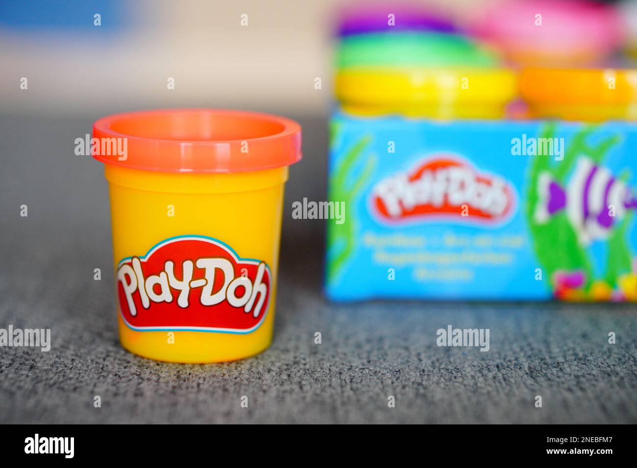 A Play Doh clay and dough in a container Stock Photo - Alamy