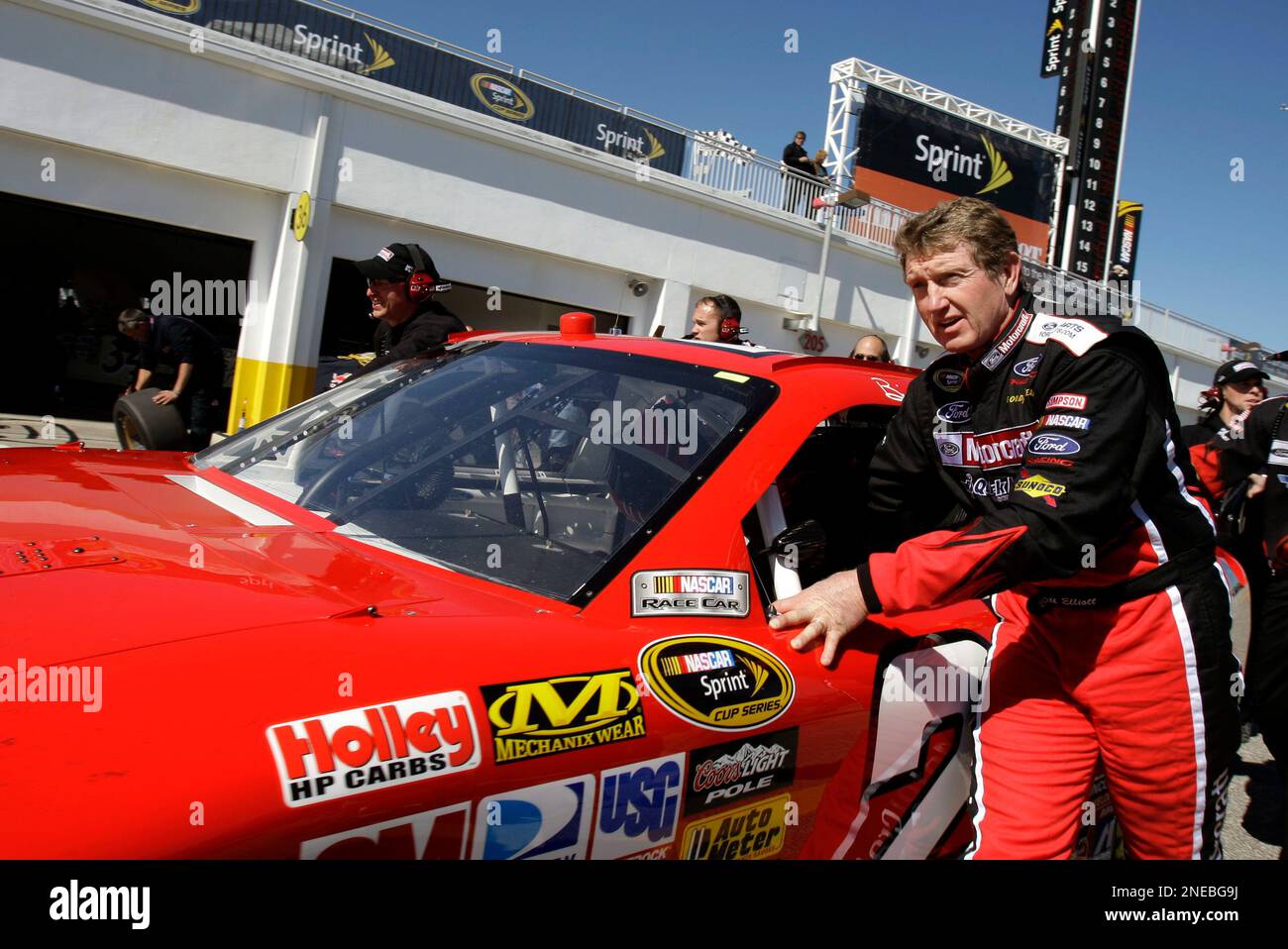 NASCAR driver Bill Elliott helps his crew push his car back to the ...