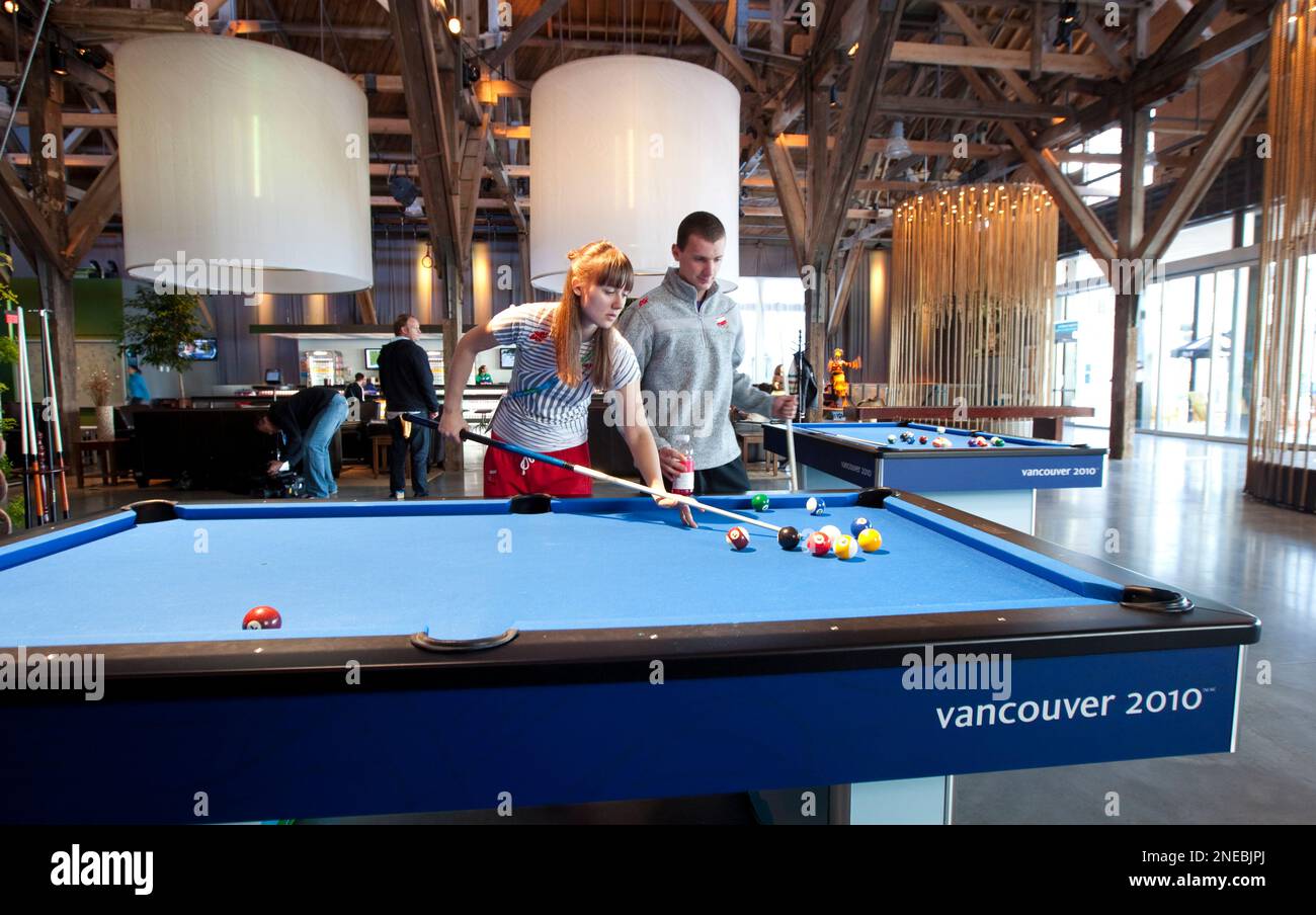 Polish athlete Katarzyna Wozniak plays pool in the athletes' village at ...