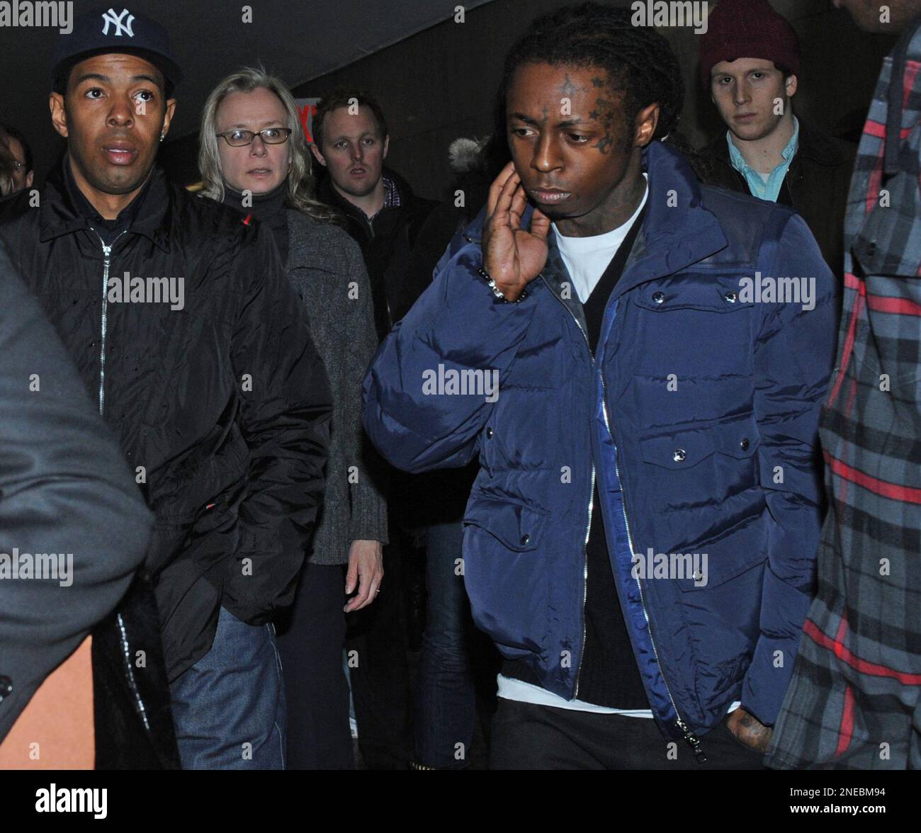 Rapper Lil Wayne, right, enters the courtroom at Manhattan criminal ...