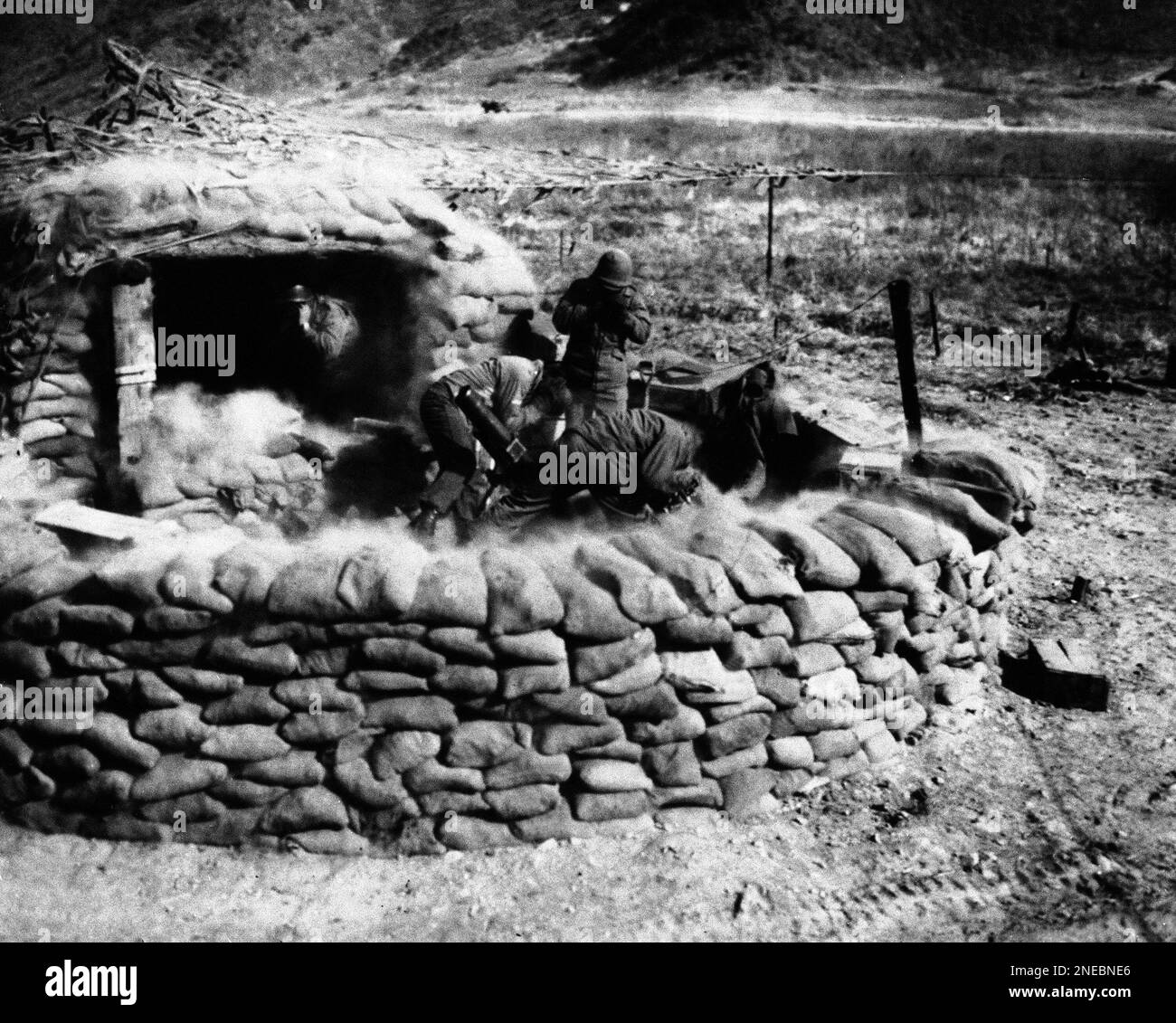 Concussion makes the dust fly from sandbags as a 4.2 mortar crew of the ...