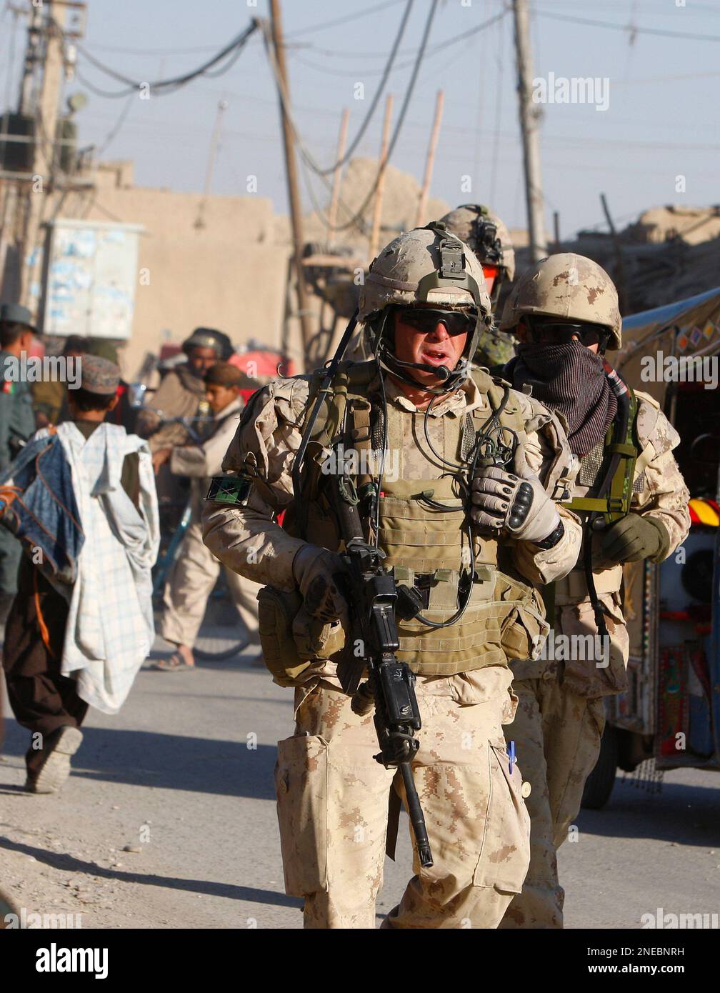 In this Jan. 18, 2010 photo, MCpl. Steve Malenfant, center, from ...