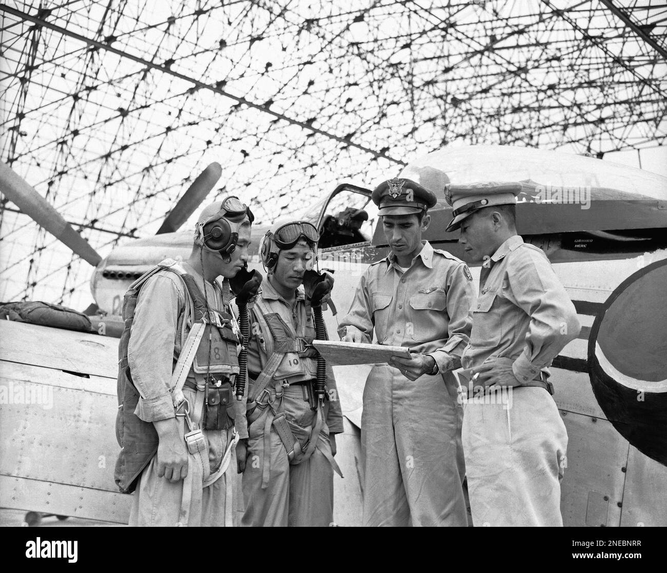 Maj. Dean Hess, second from right, of Marietta, Co., points out target ...
