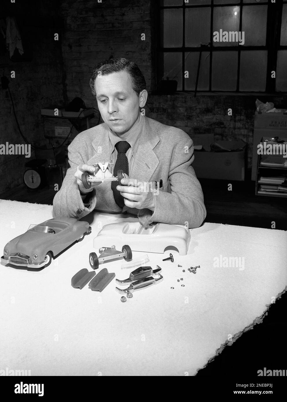Ira Yarbrough, former commercial artist and free lance cartoonist holds ...