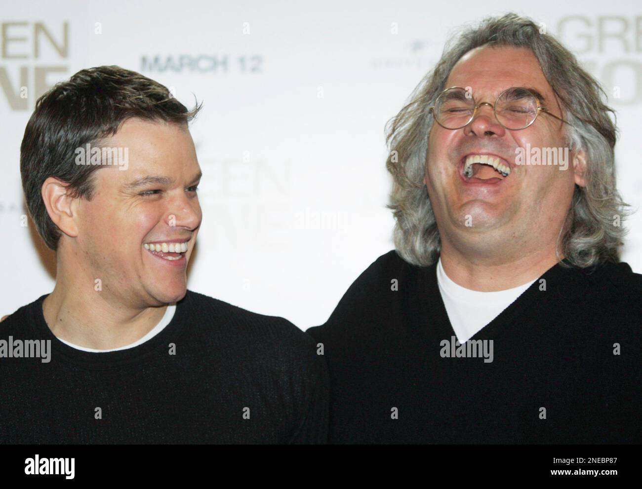 U.S. actor Matt Damon, left, and director Paul Greengrass, right, laugh ...