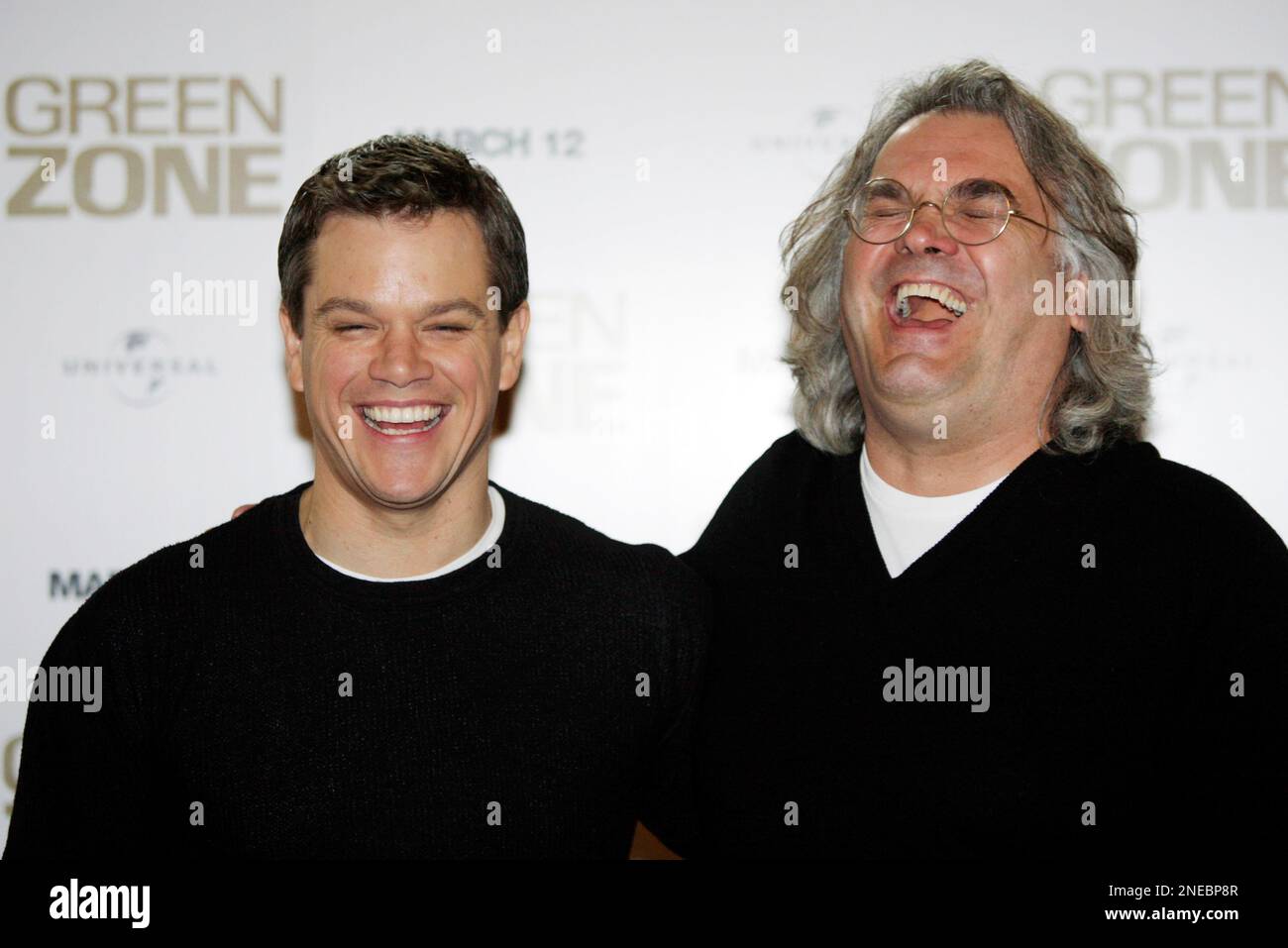 U.S. actor Matt Damon, left, and director Paul Greengrass, right, laugh ...