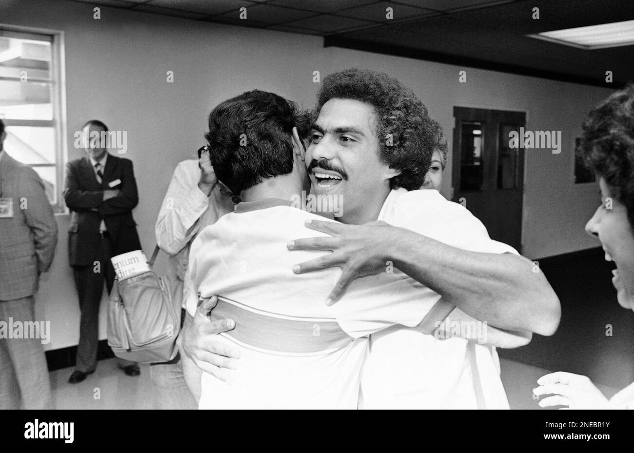 Jorge Carillo shows his emotion as he embraces a relative at Miami ...