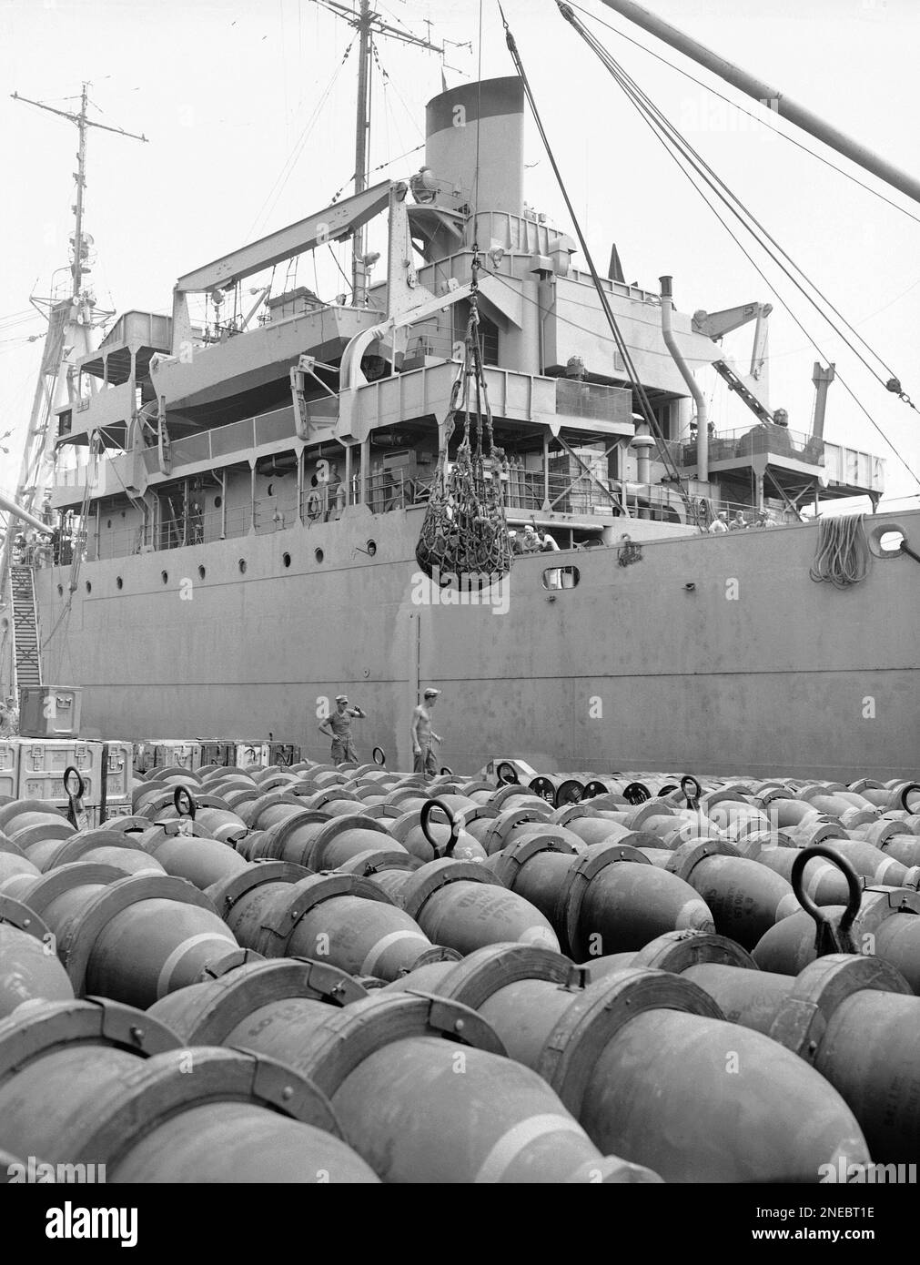 Five Hundred-pound bombs (foreground) are loaded aboard the attack ...
