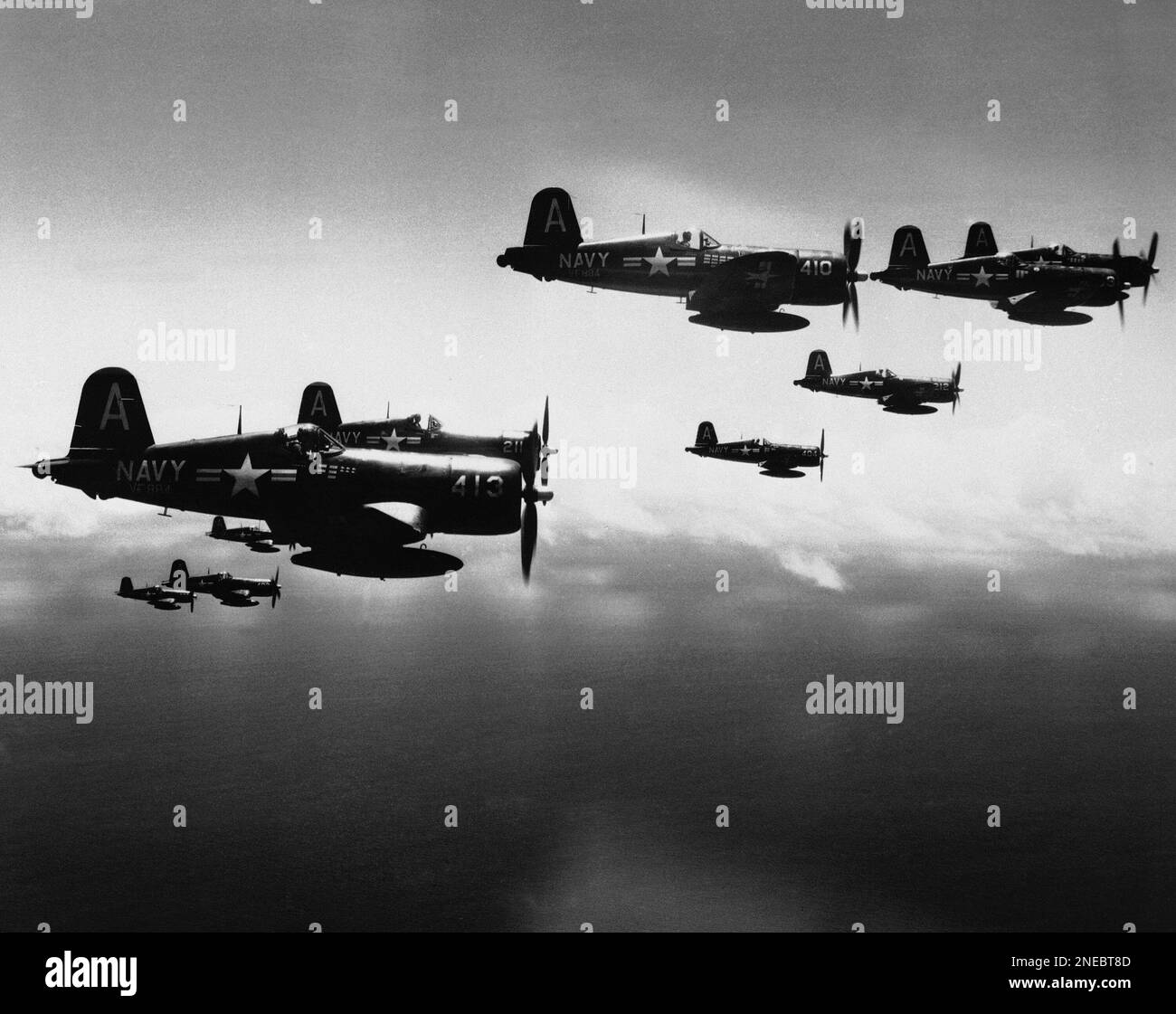 A flight of Navy Corsairs from the fast carrier USS Boxer roars through ...