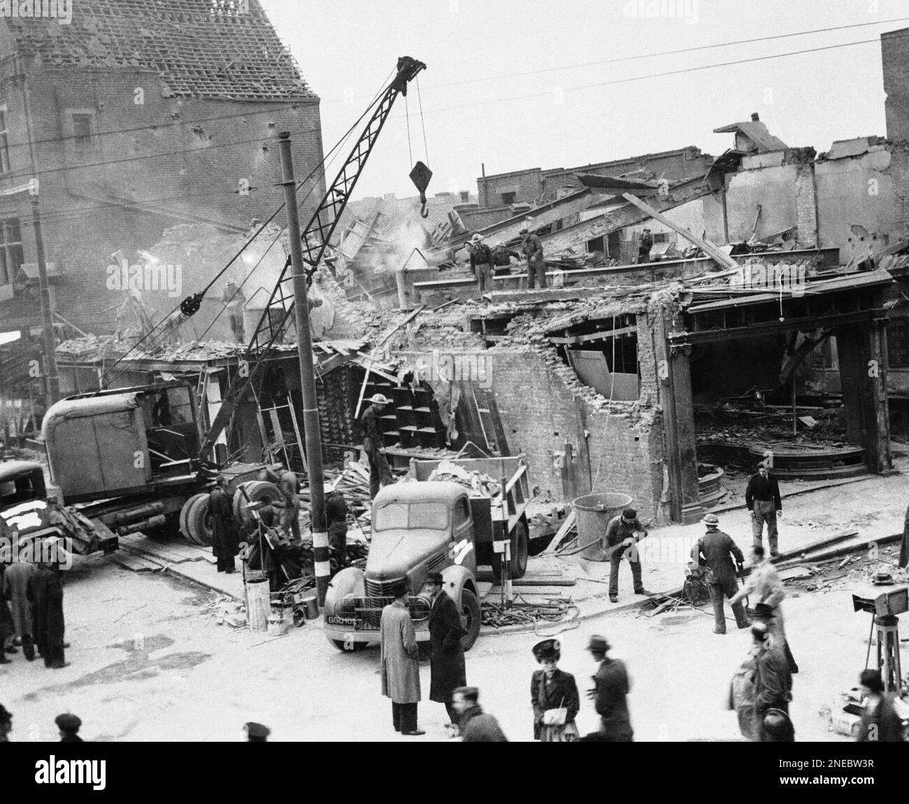 Salvage crews clear away wreckage of a Dance Hall and milk bar in ...