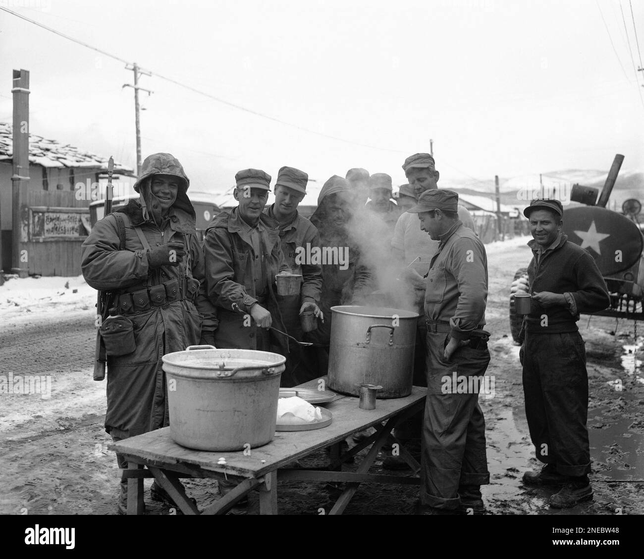 Marines of the second battalion, seventh regiment, line up for hot ...