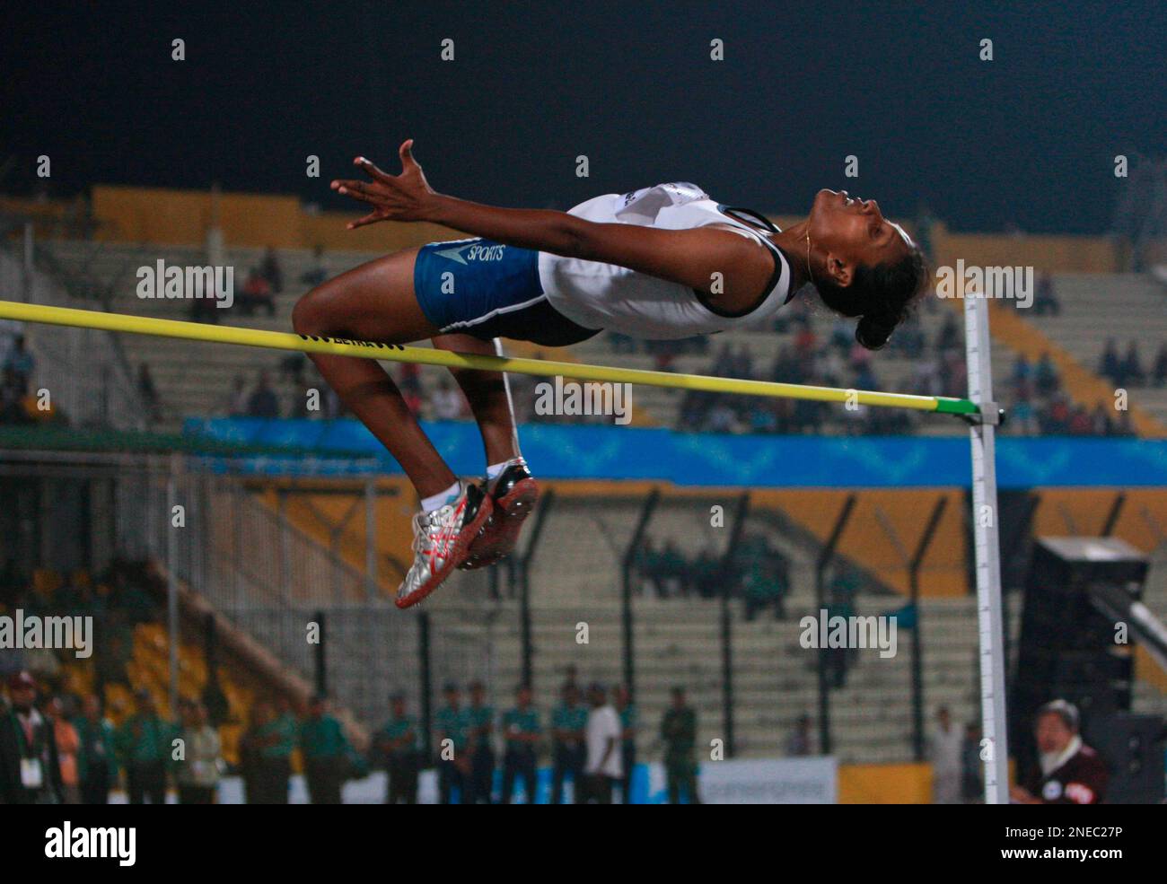Sri Lanka’s Priyangika Madumanthi crosses the bar during a high jump ...