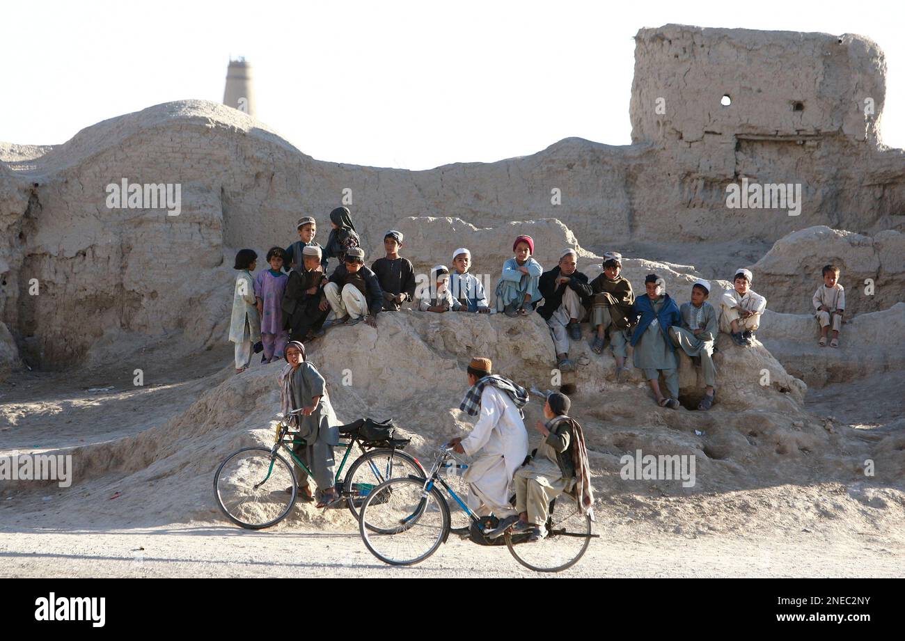 In this photo made Jan. 19, 2010, Afghan children watch soldiers from ...