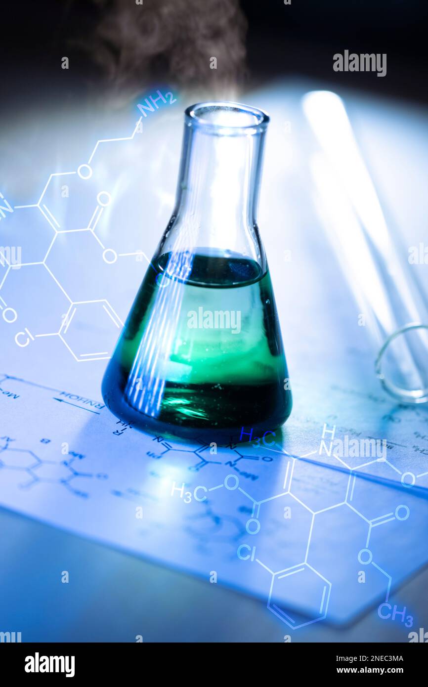 Chemical tubes with reaction formulas Stock Photo - Alamy