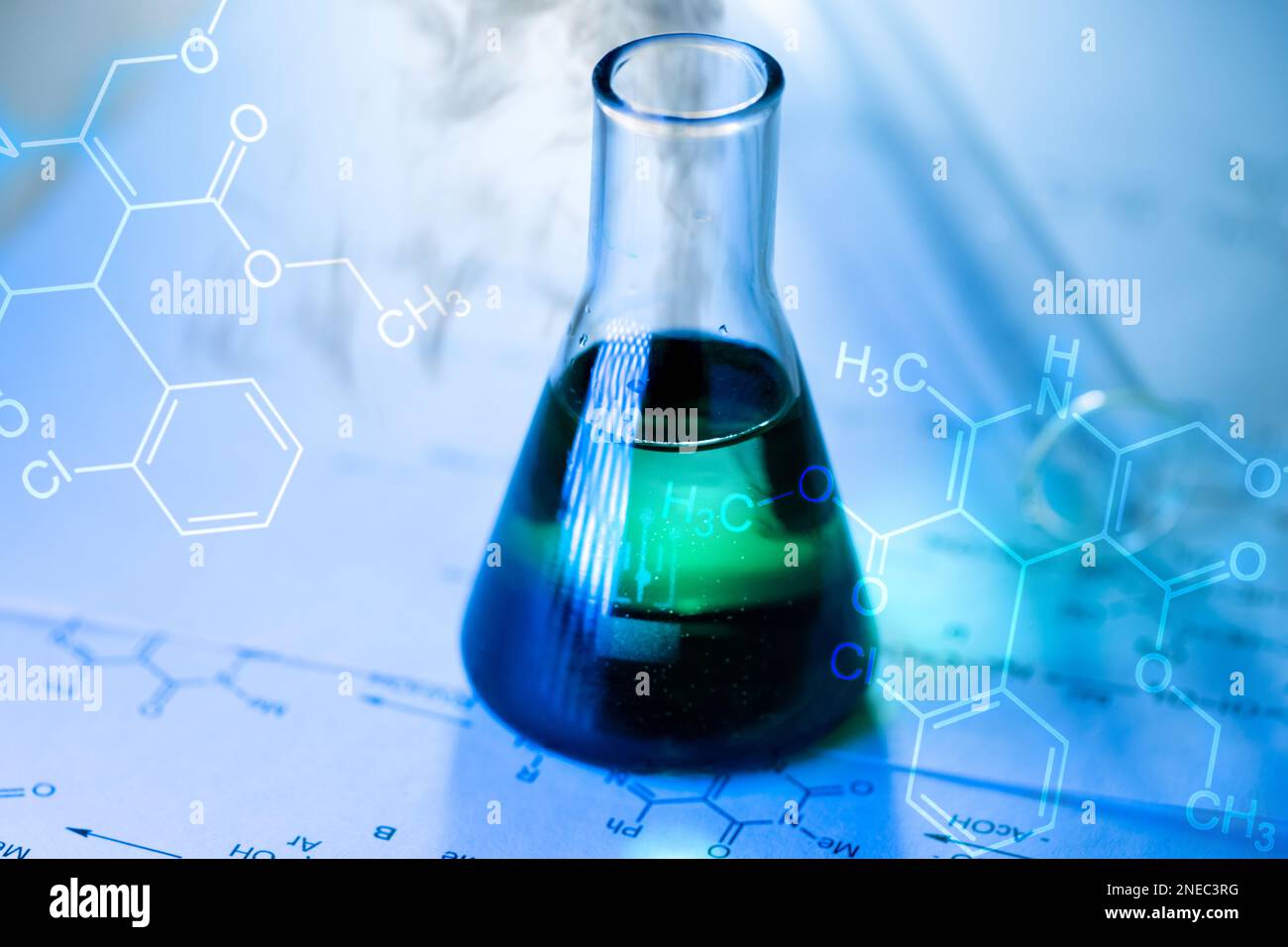 Chemical tube with reaction formula in light Stock Photo - Alamy