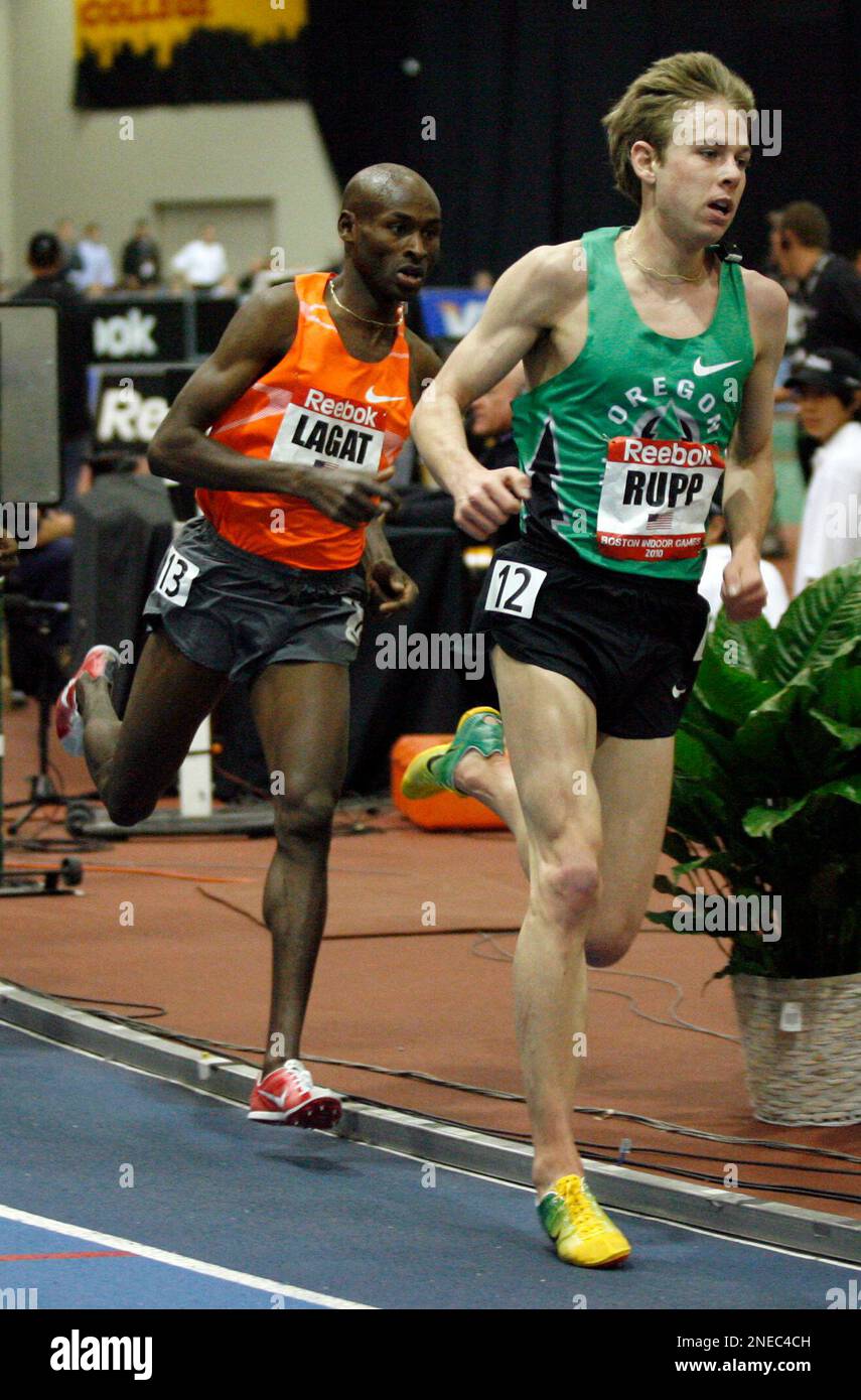 Galen Rupp leads the 5000-meter race for a lap ahead of Bernard Lagat ...