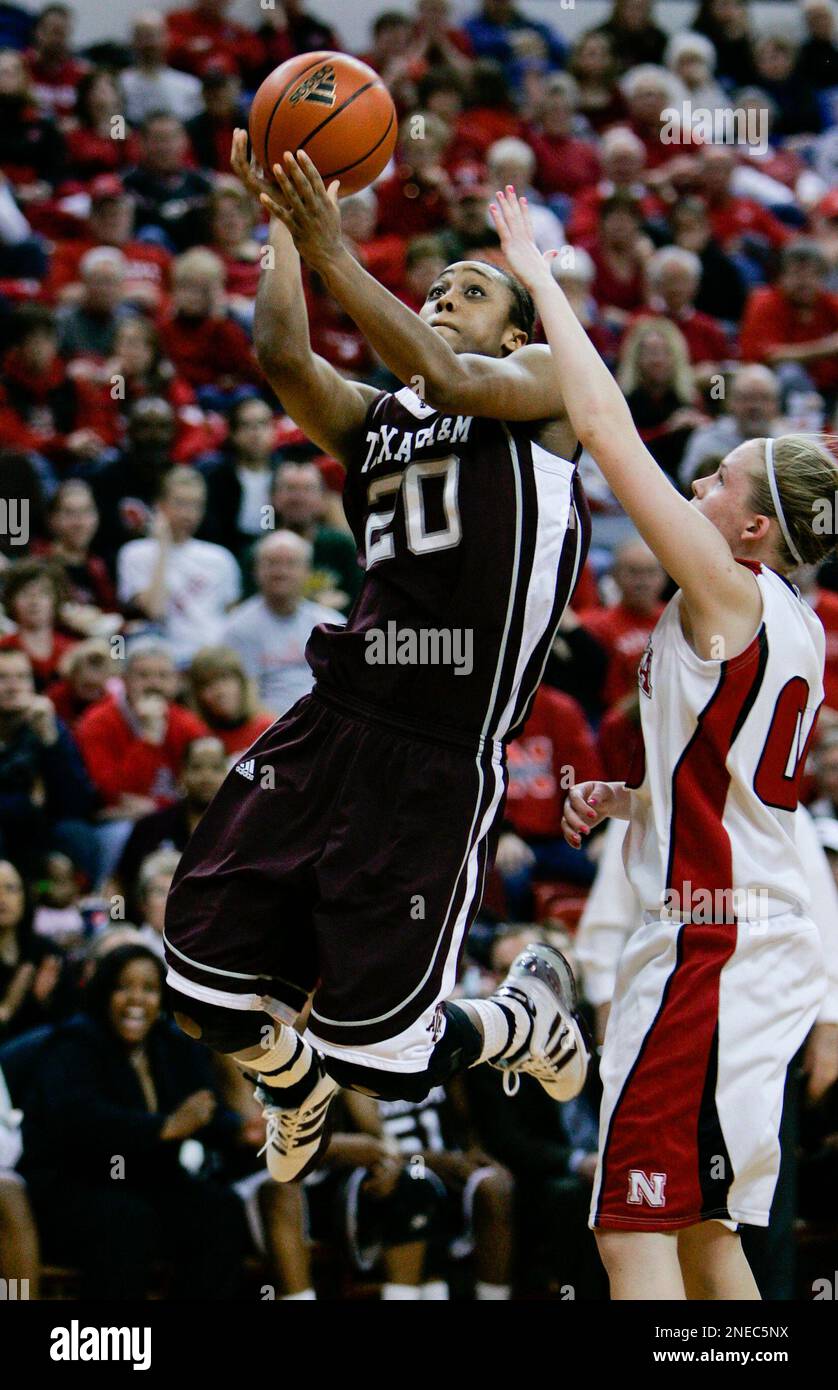Texas A&M''s Tyra White (20) shoots past Nebraska's Lindsey Moore ...