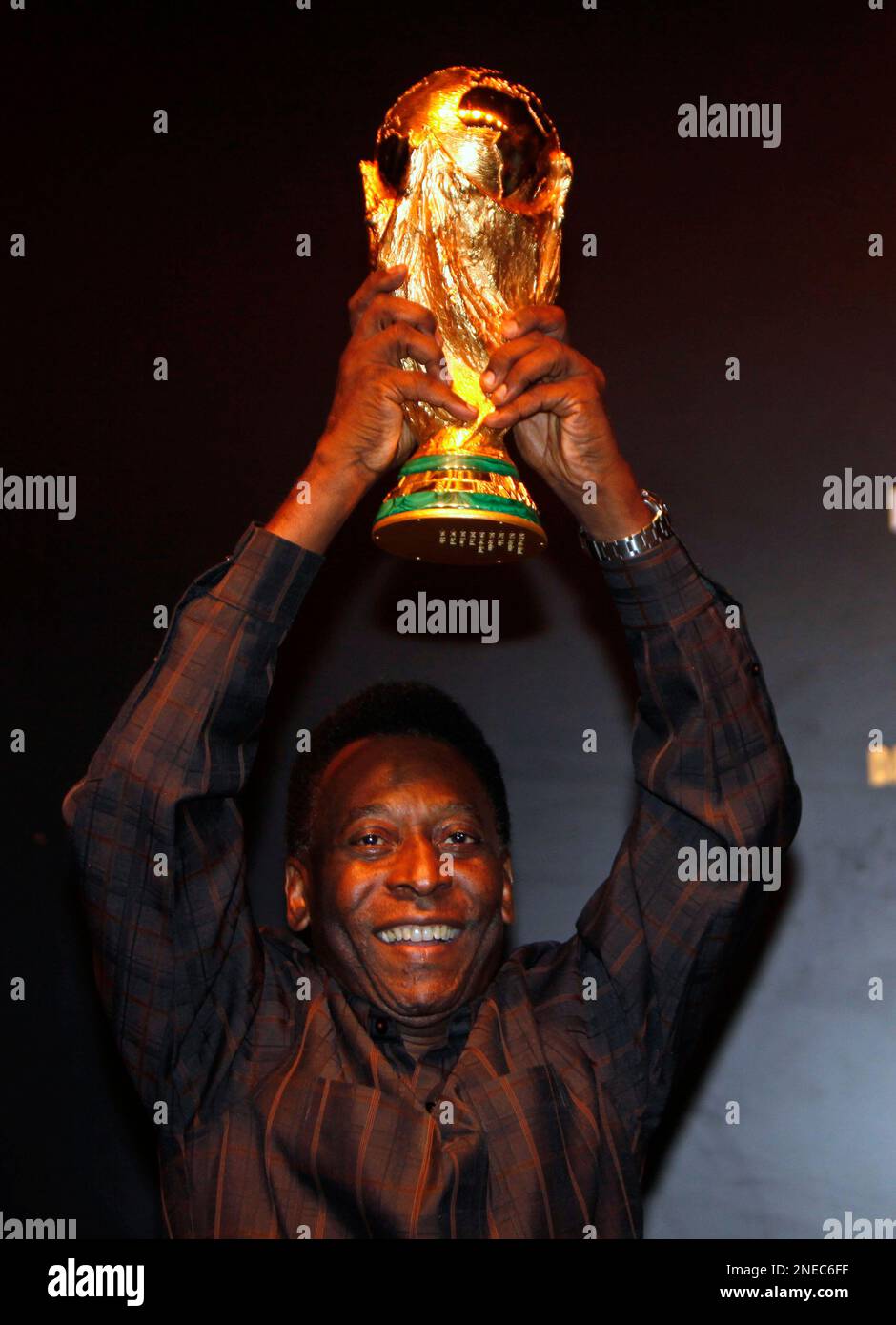 Former star soccer player Edison Arantes do Nascimento, Pele, holds up ...