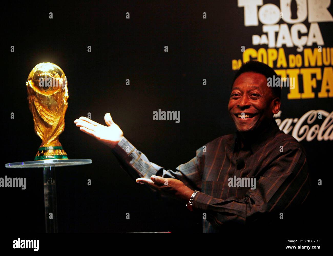 Former star soccer player Pele presents the FIFA World Cup trophy in ...