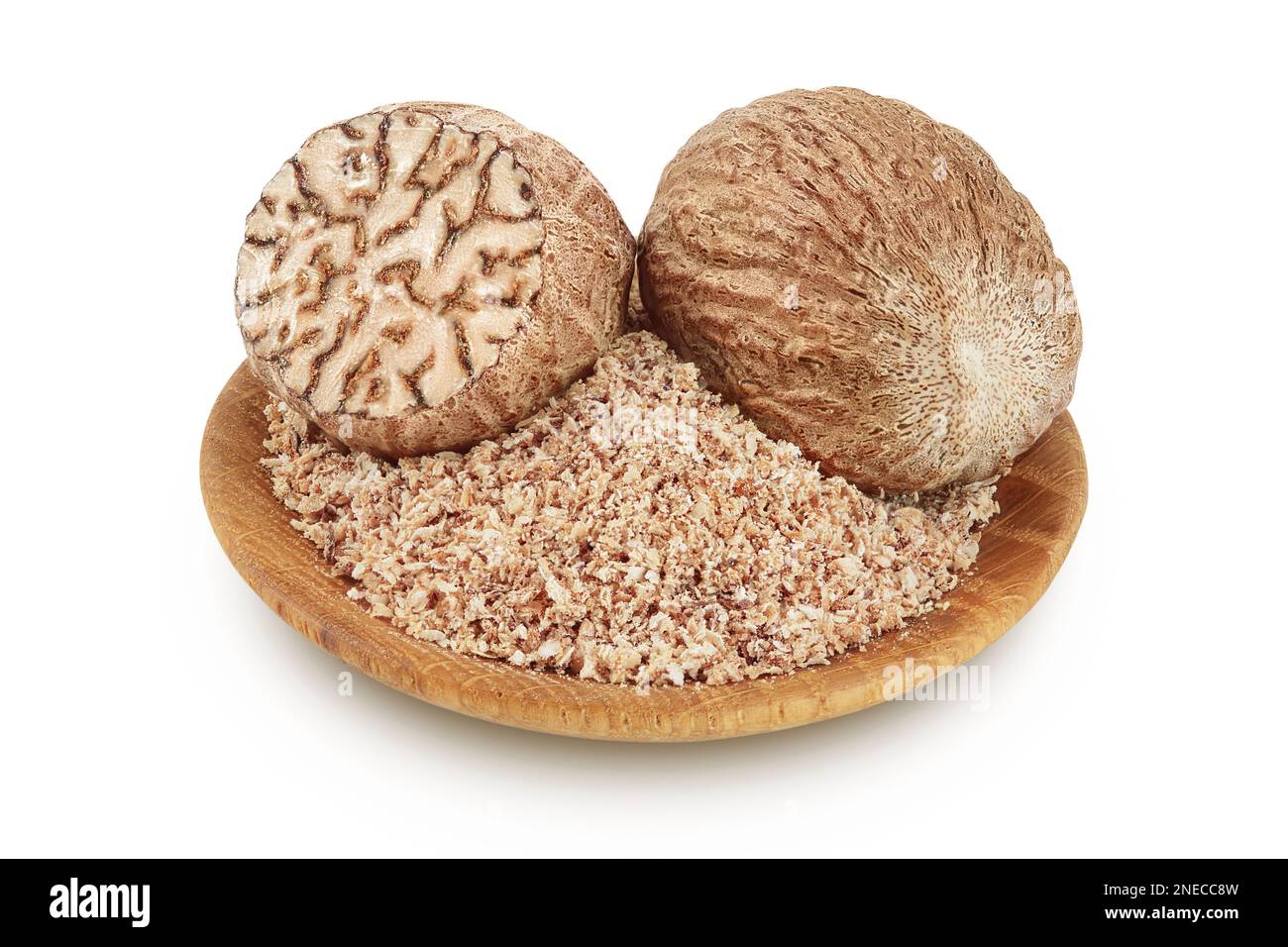Whole and grated nutmeg in wooden bowl isolated on white background ...