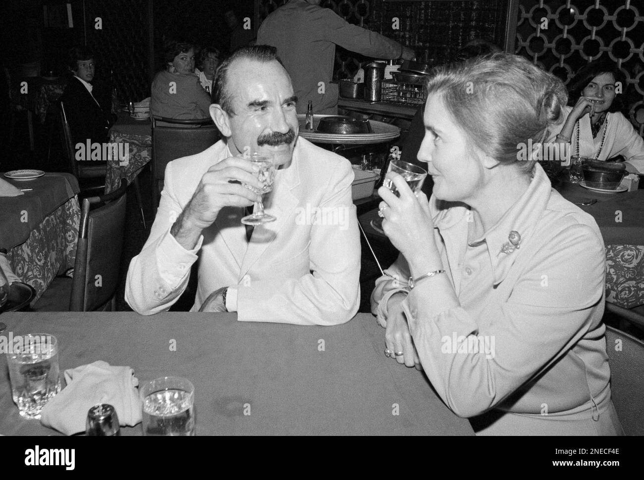 Watergate figure G. Gordon Liddy and his wife Frances drink a toast at ...