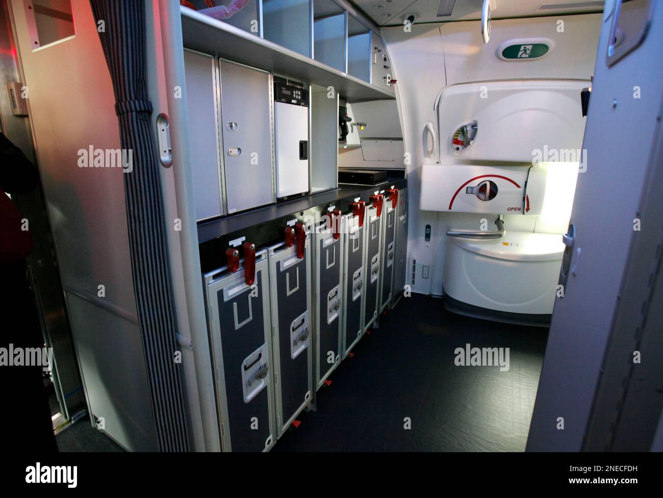 A galley and exit inside the first Boeing 787 with the interior ...