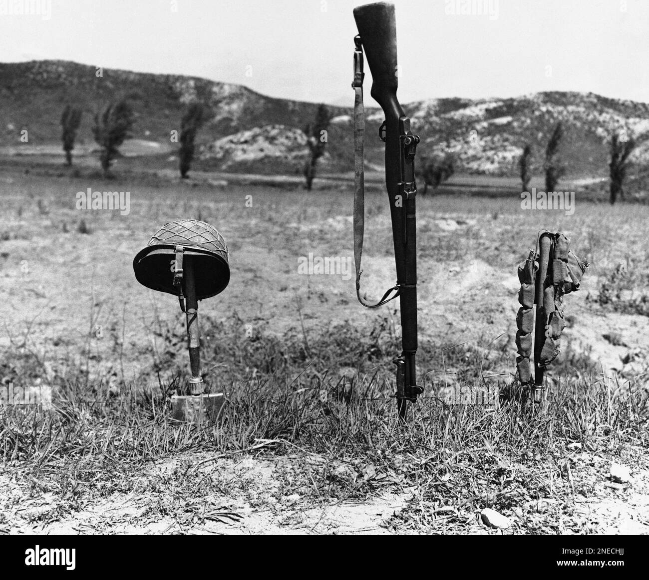 His Helmet, rifle and ammunition belt mark spot where an unidentified U ...