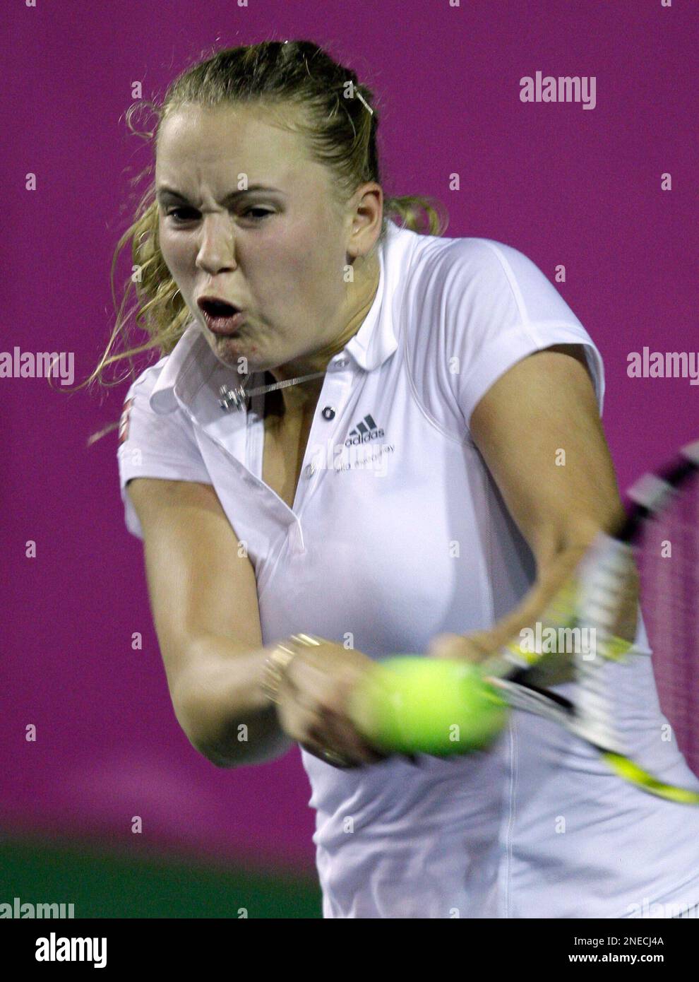 Denmark's Caroline Wozniacki returns a ball to Sweden's Sofia Arvidsson ...
