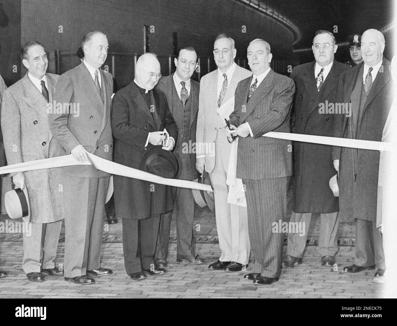 New York City Mayor William O?Dwyer (sixth from left), cuts the tape at ...