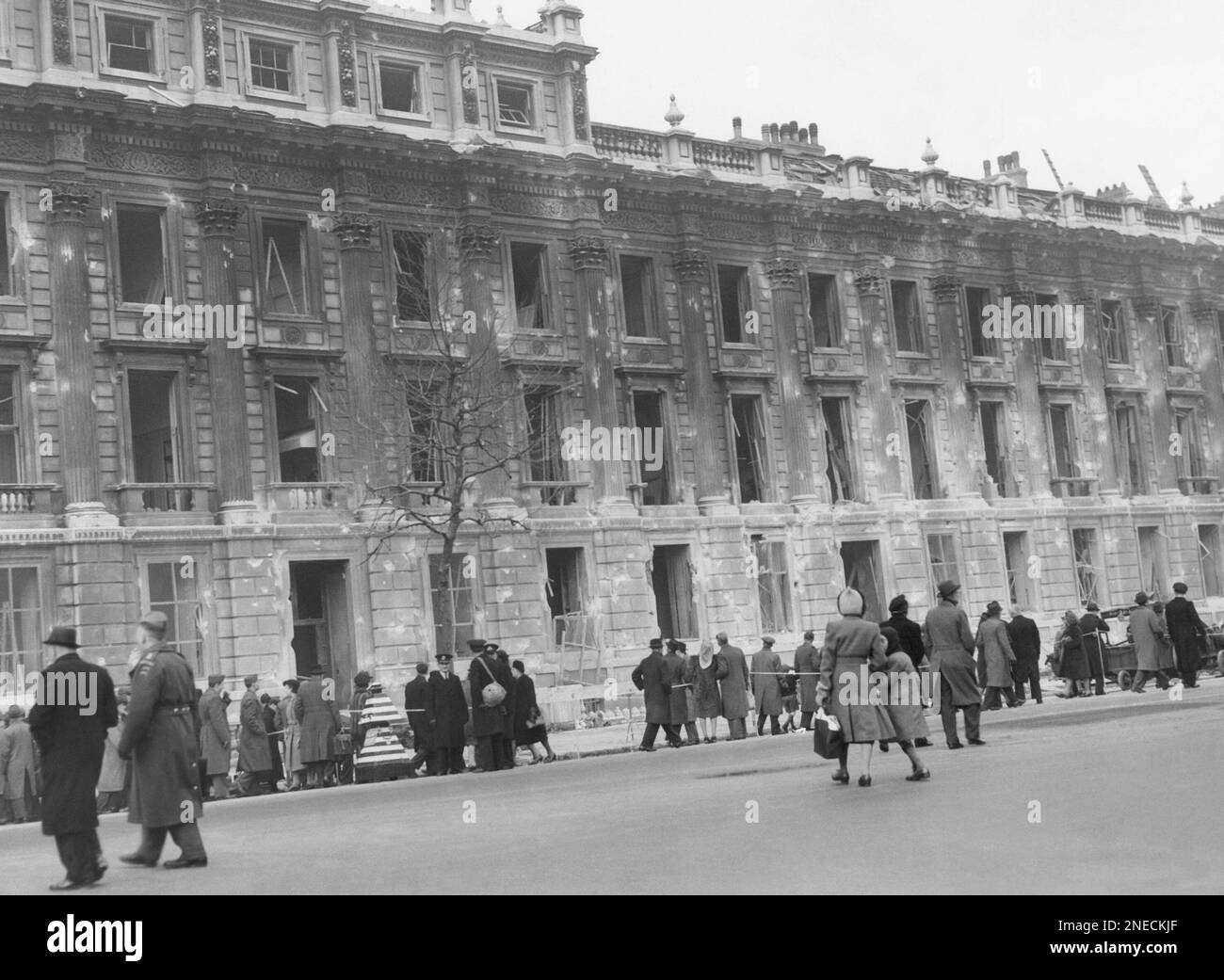 Gaping window frames and pocked walls, April 20, 1945 show the damage ...