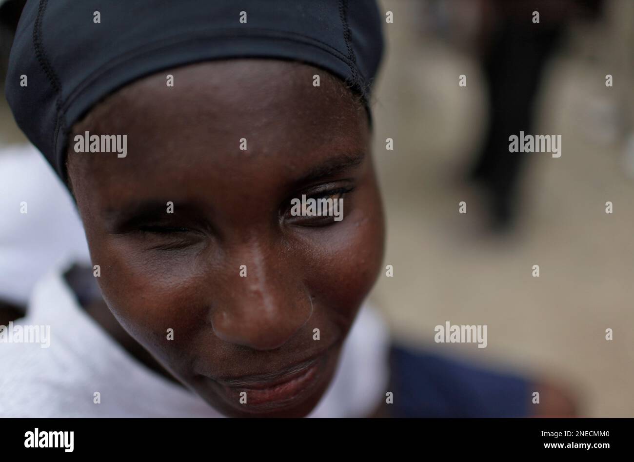 Marie Joseph, 27, waits in the backyard of a center for blind people ...