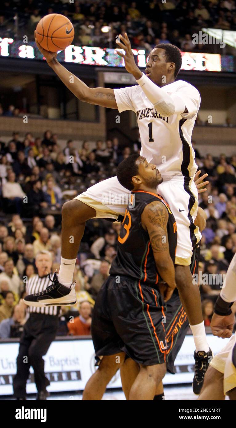 Wake Forest's Al-Farouq Aminu (1) drives into Miami's James Dews (23 ...