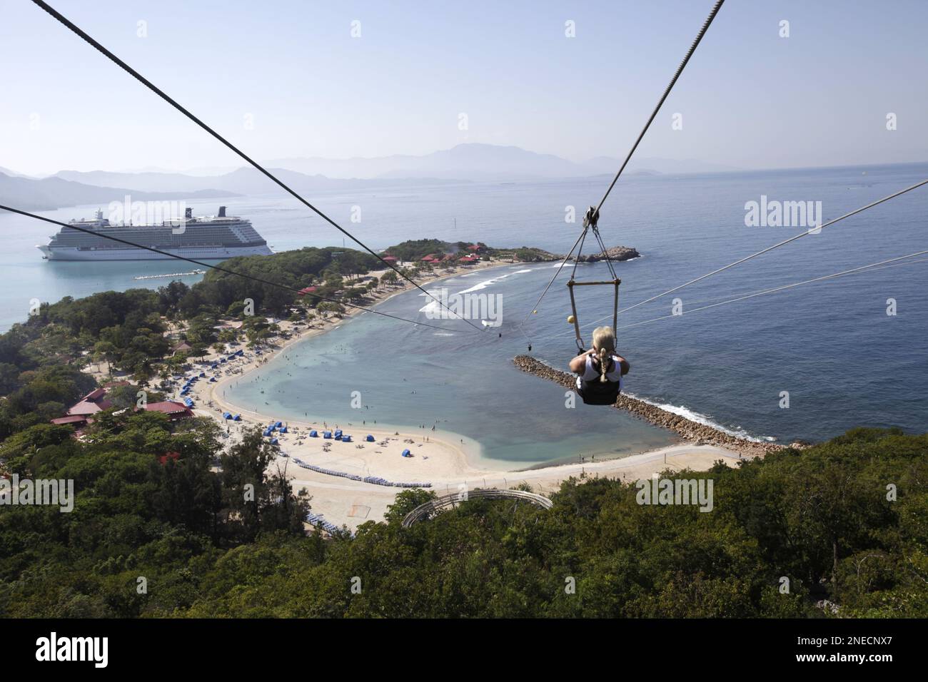 Passengers from the Celebrity Cruises ship Solstice zipline in Labadee ...