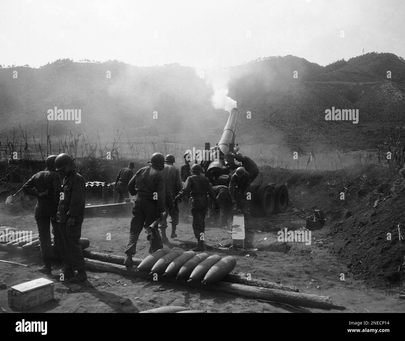 White smoke rises from the barrel of a giant eight-inch howitzer on the ...
