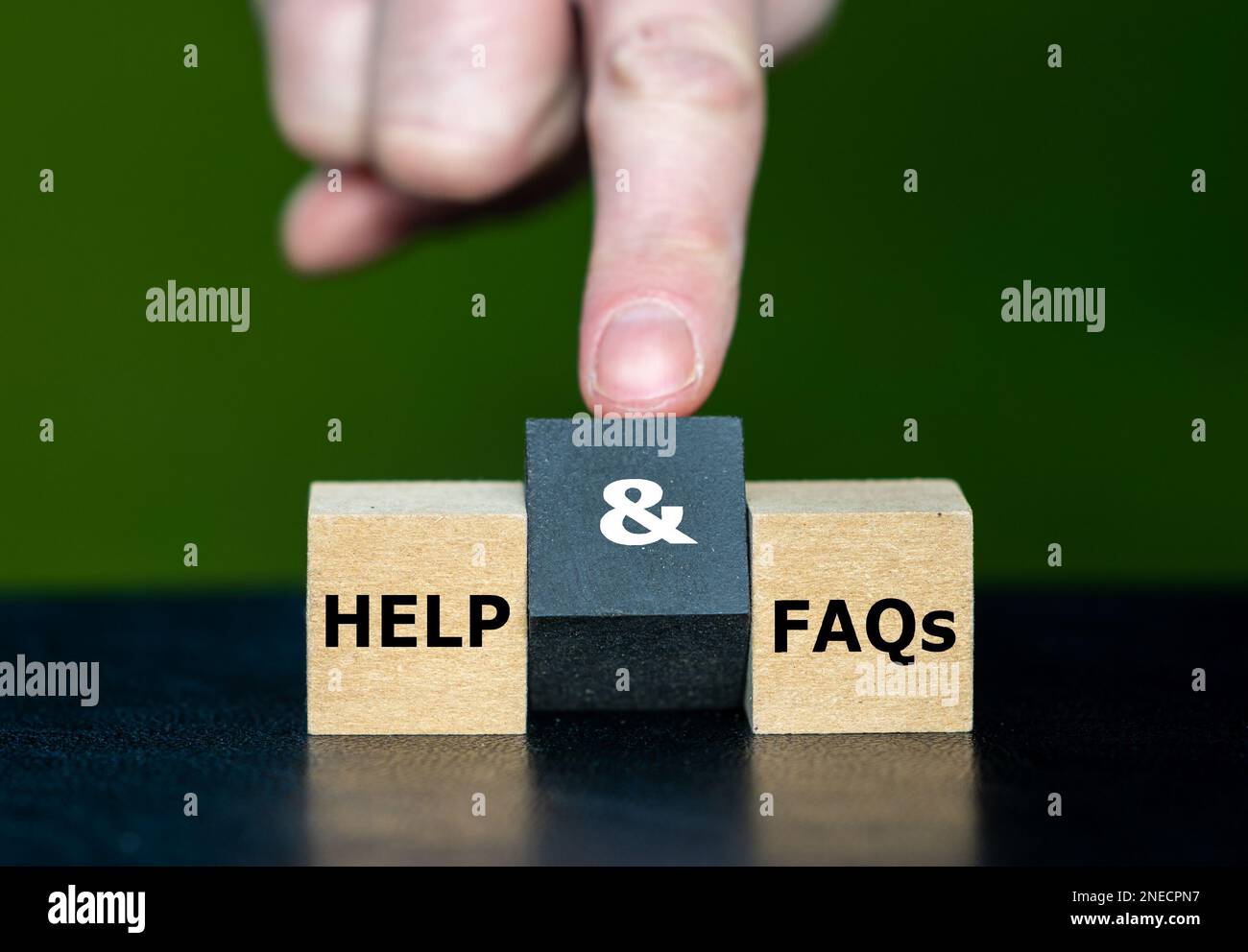 Wooden cubes form the expression 'help and FAQs' Stock Photo - Alamy