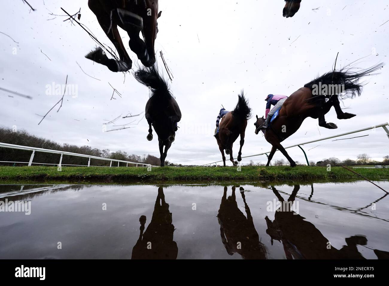 Runners and riders clear a fence during the Constant Security Services ...