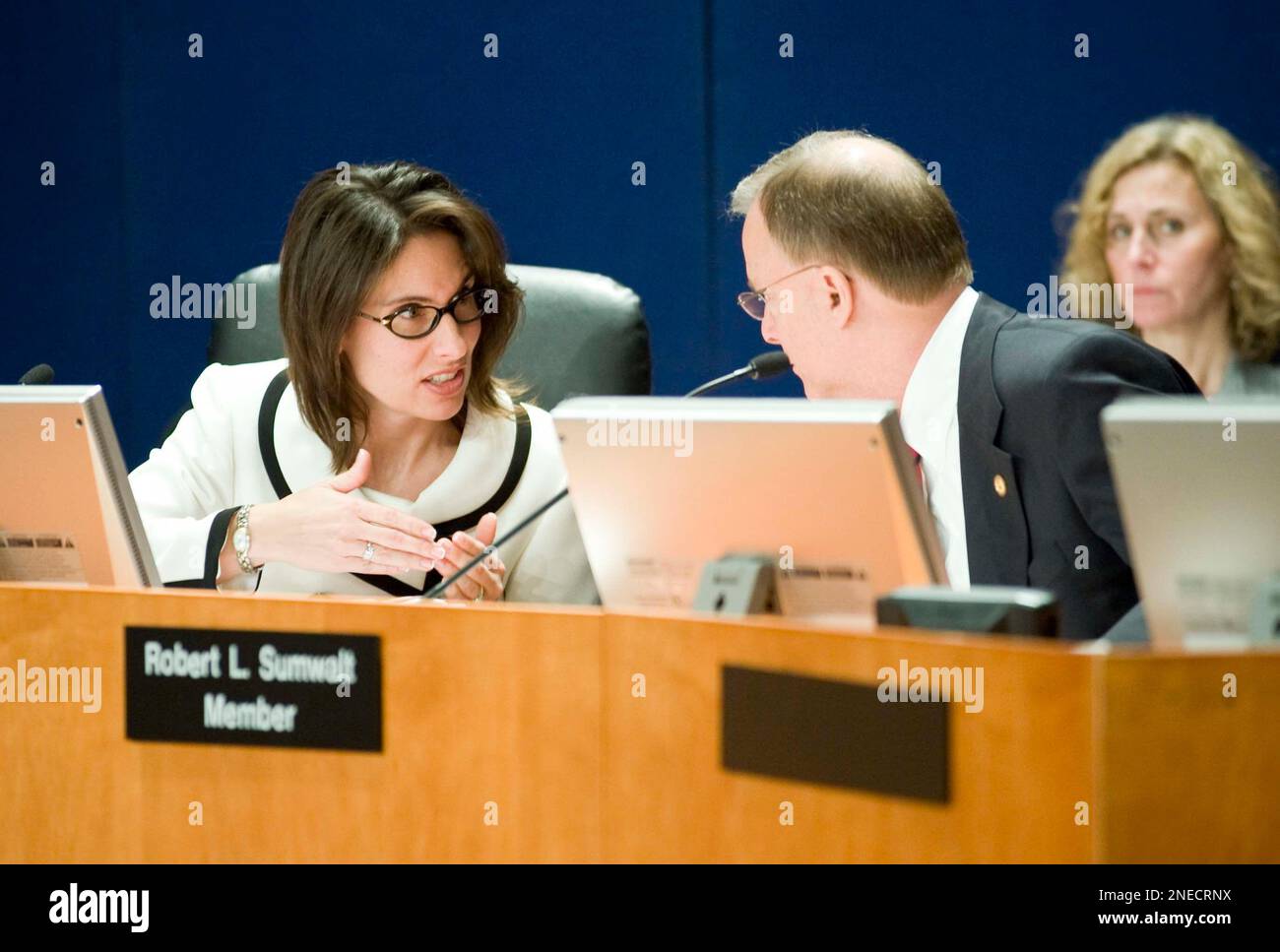 National Transportation Safety Board Chair Debbie Hersman, left, talks ...