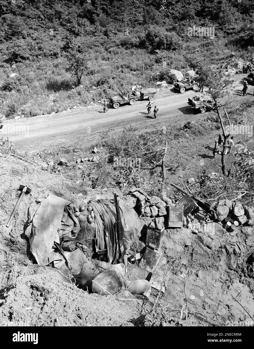 A lone U.S. sentry catches the proverbial 40 winks in his machine gun ...