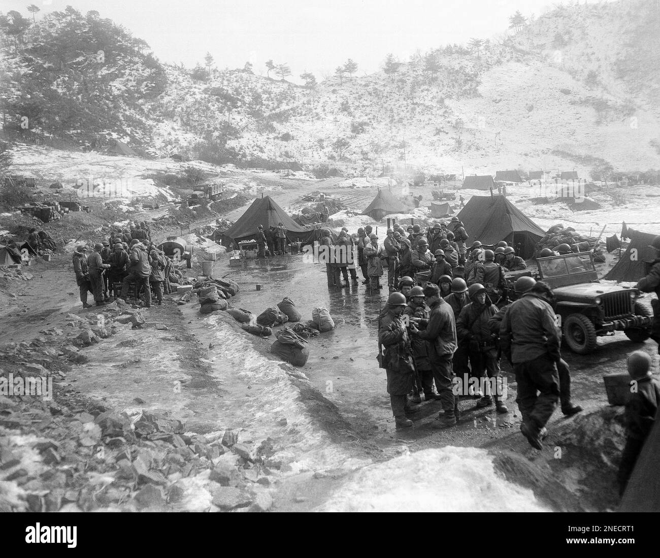 Members of the U.S. 40th Infantry Division 160th regiment wait by ...