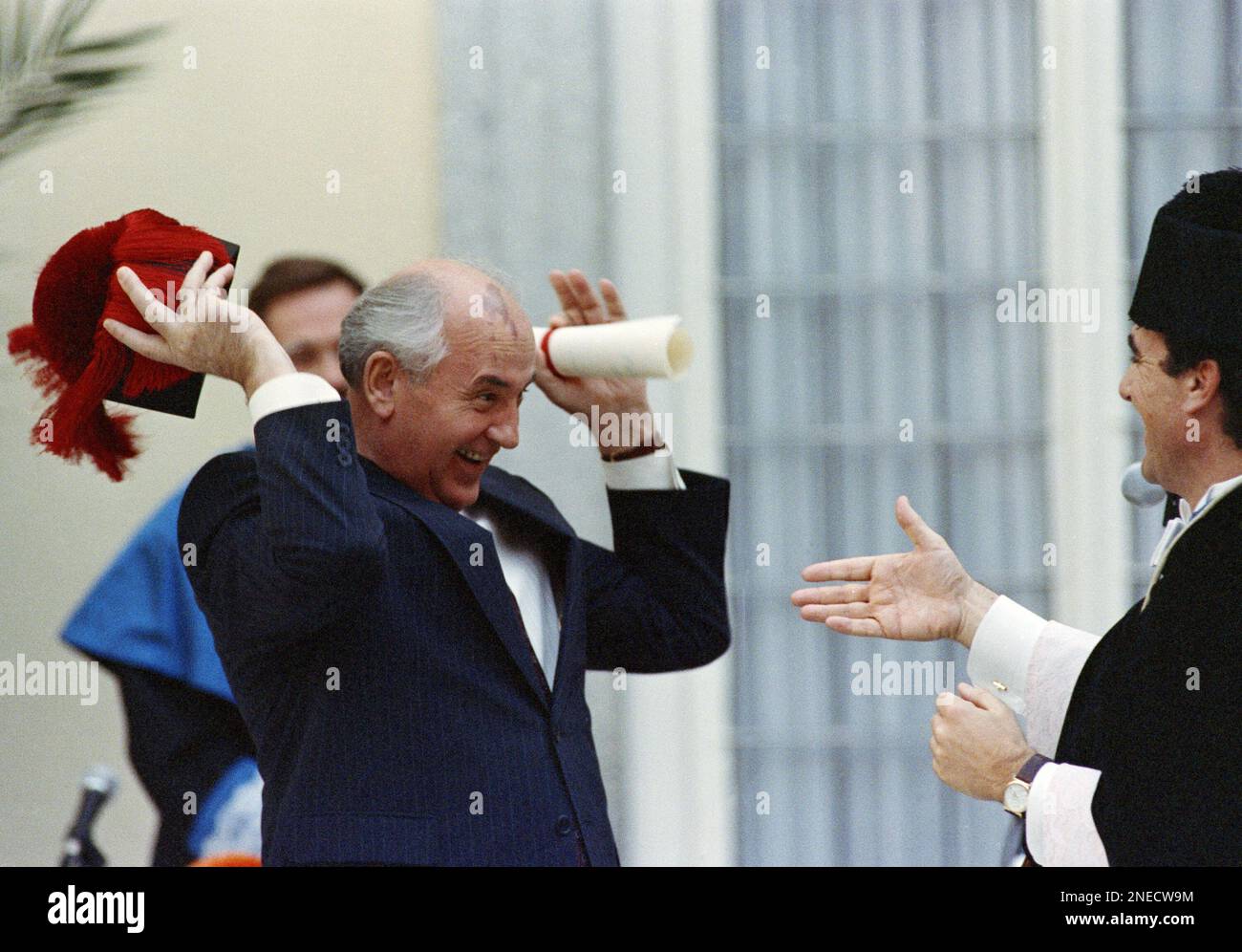 Soviet President Mikhail Gorbachev removes a medieval academic cap ...