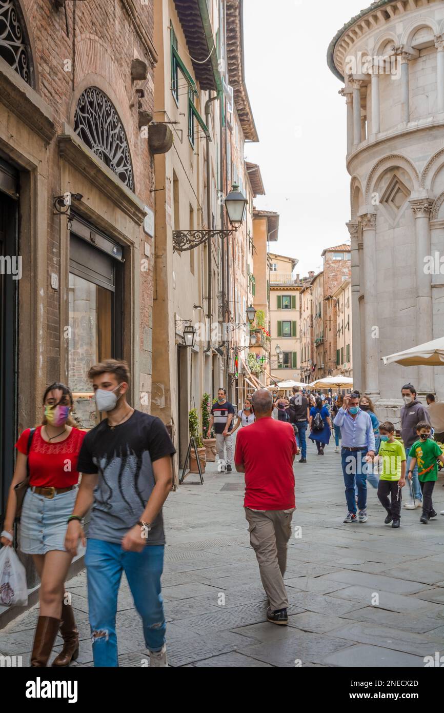 typical medieval alley in the medieval city of Lucca in Tuscany ...
