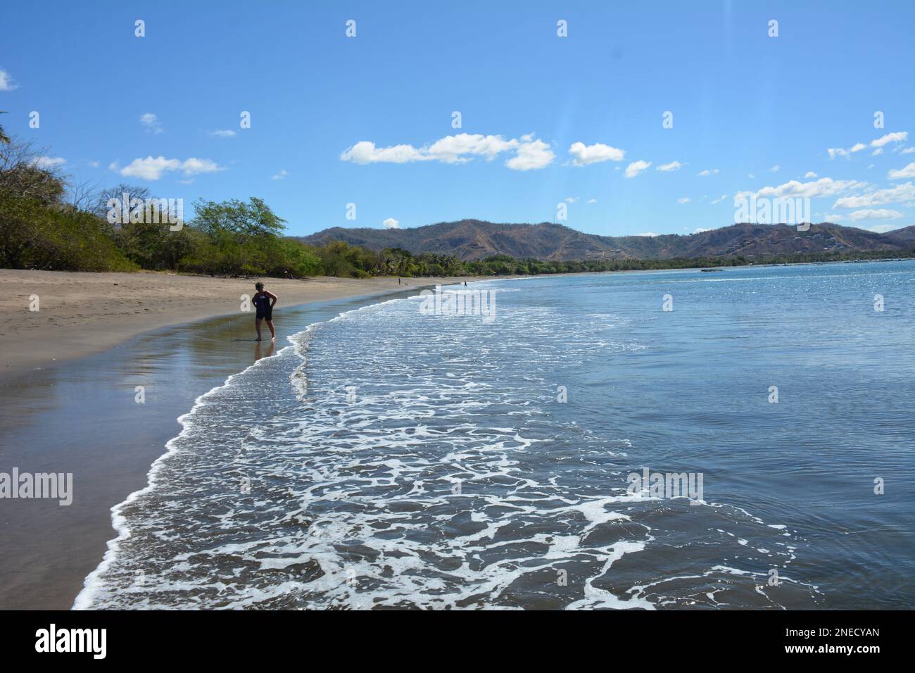 Single person on beach at Playa de Coco , Costa Rica Stock Photo - Alamy