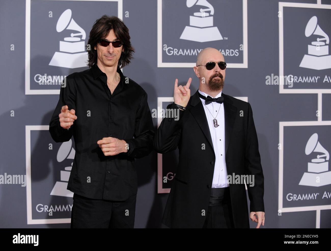 Scott Travis, left, and Rob Halford, of Judas Priest, arrive at the ...