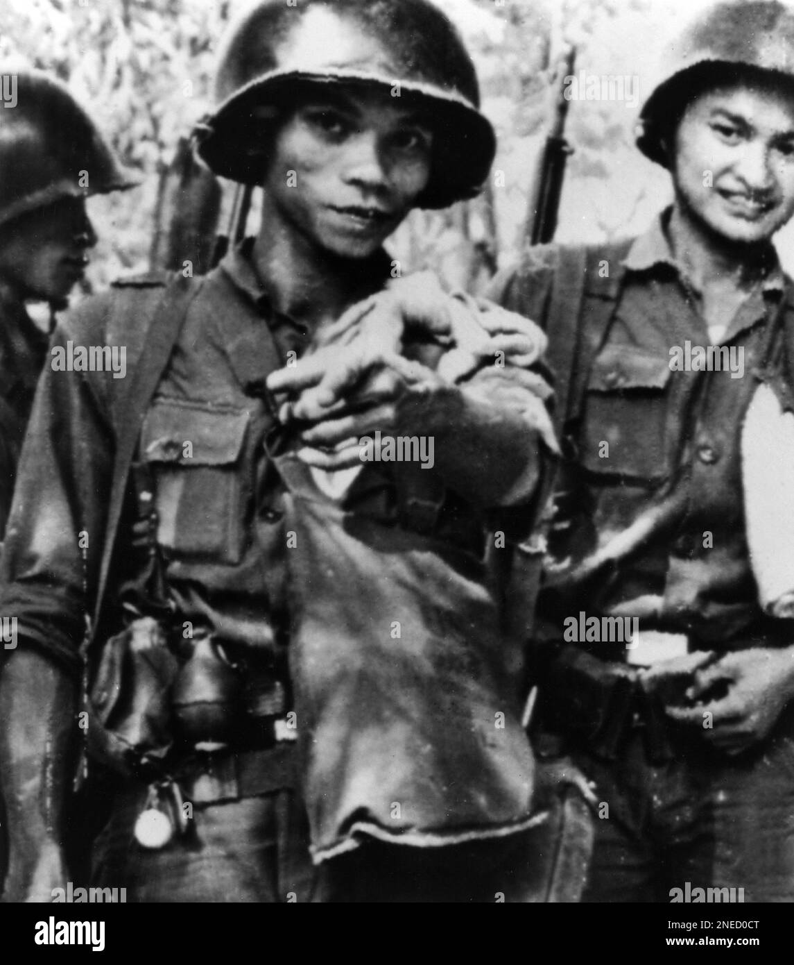 Vietnamese soldiers gesture in March 1965 during the Vietnam war at an ...