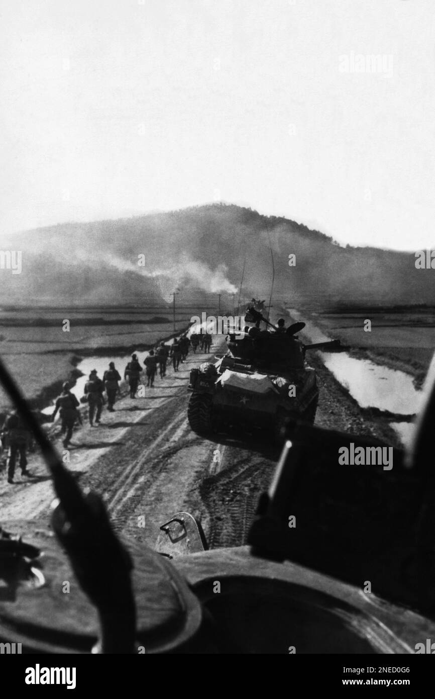 American tanks fire on enemy targets in Korea as British infantrymen of ...