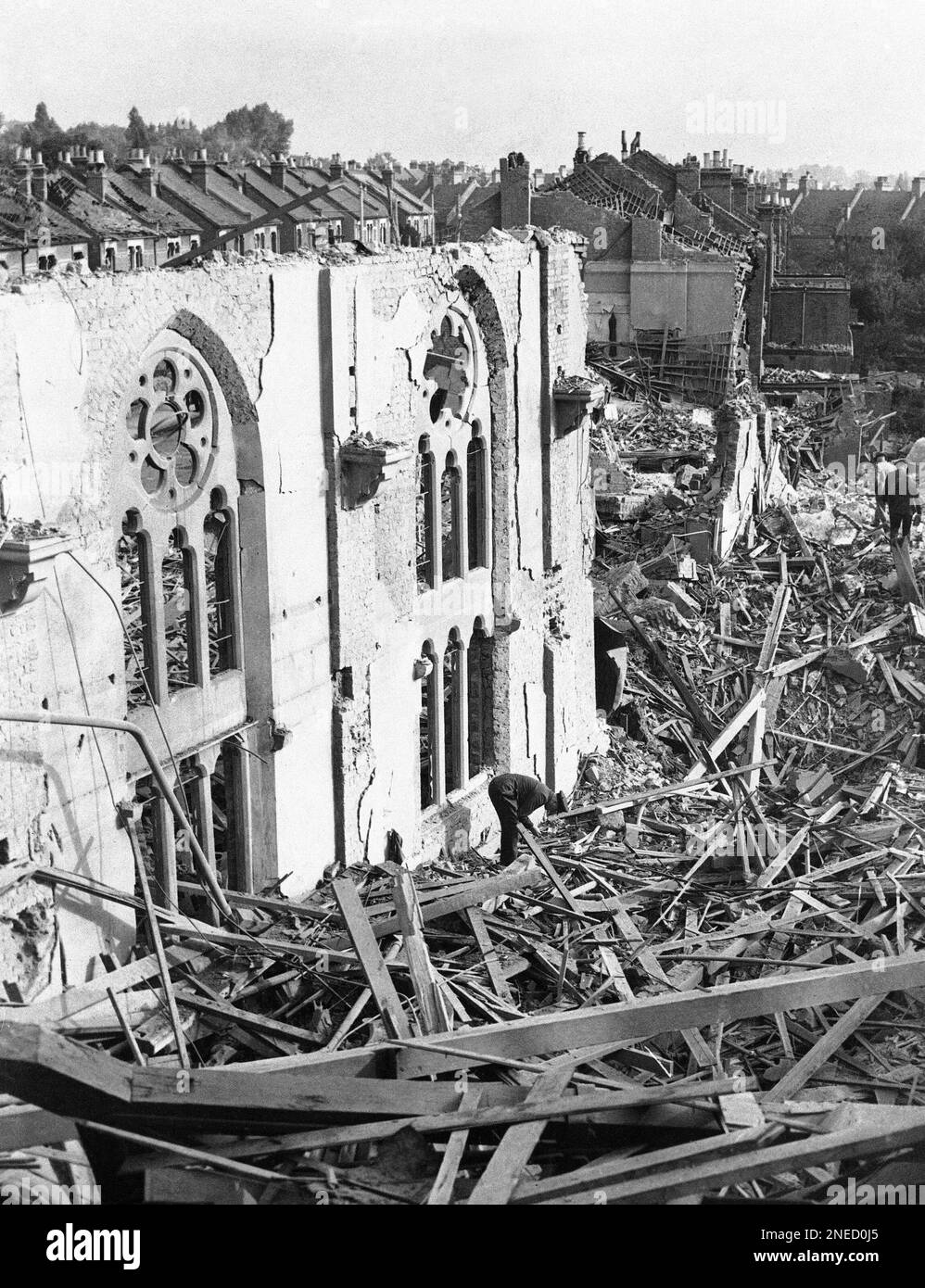 A section of wall stands amid debris after a Baptist church in southern ...