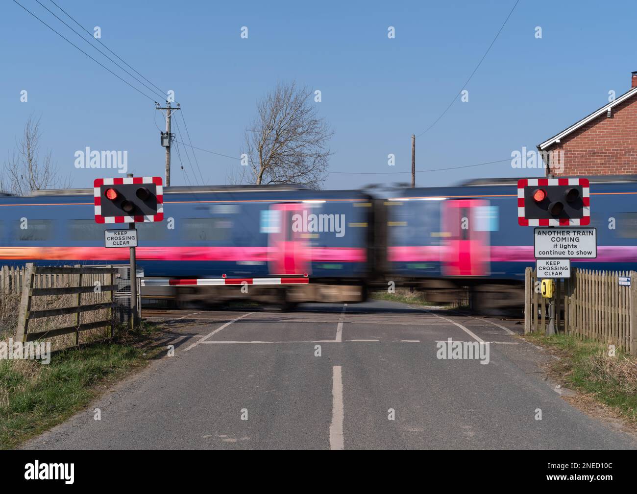 24 March 2022 - A moving train passing over an automatic half barrier ... 24 March 2022 - A moving train passing over an automatic half barrier ...