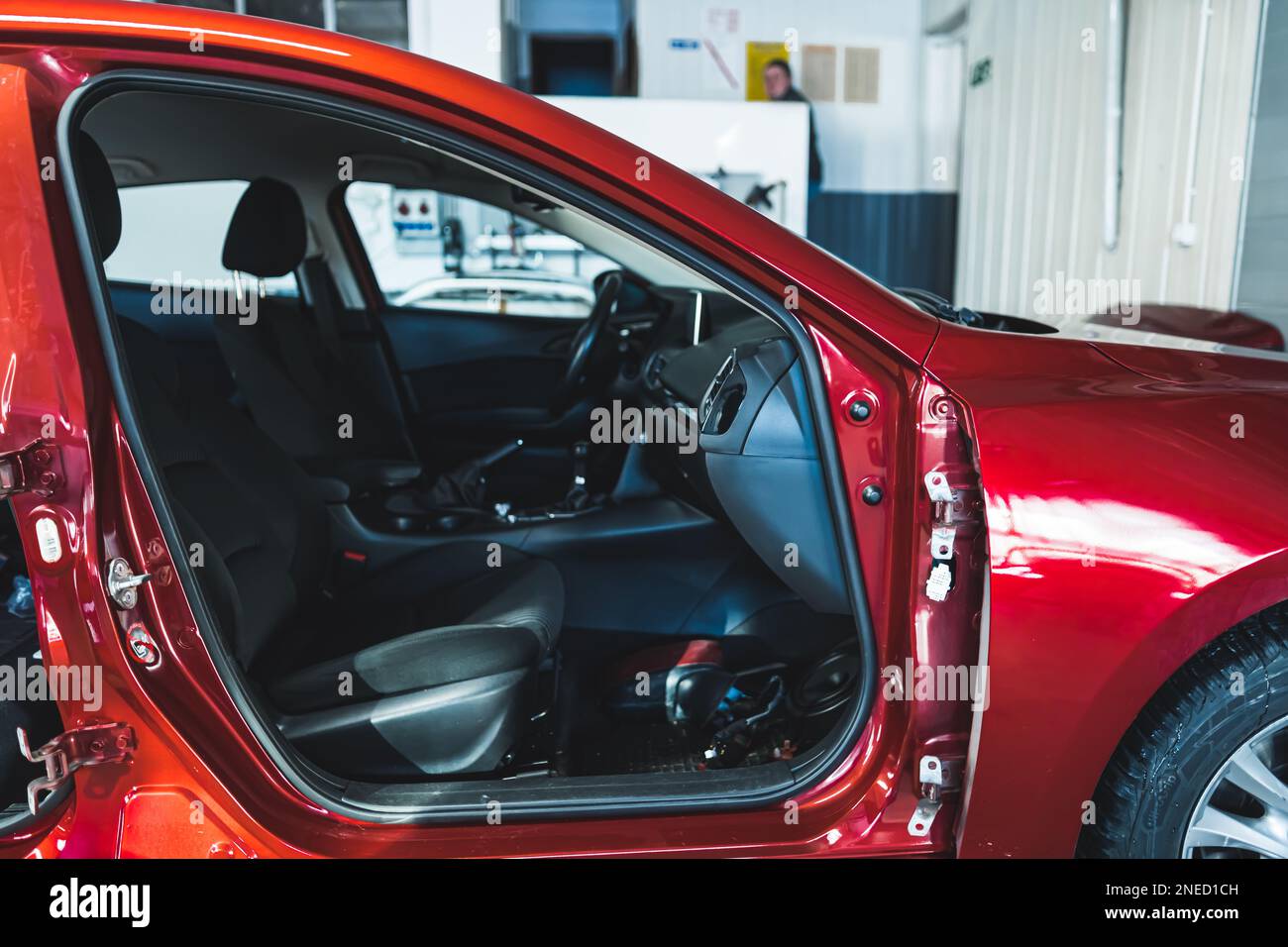 Medium shot of red car without doors. Repair shop concept. High quality ...