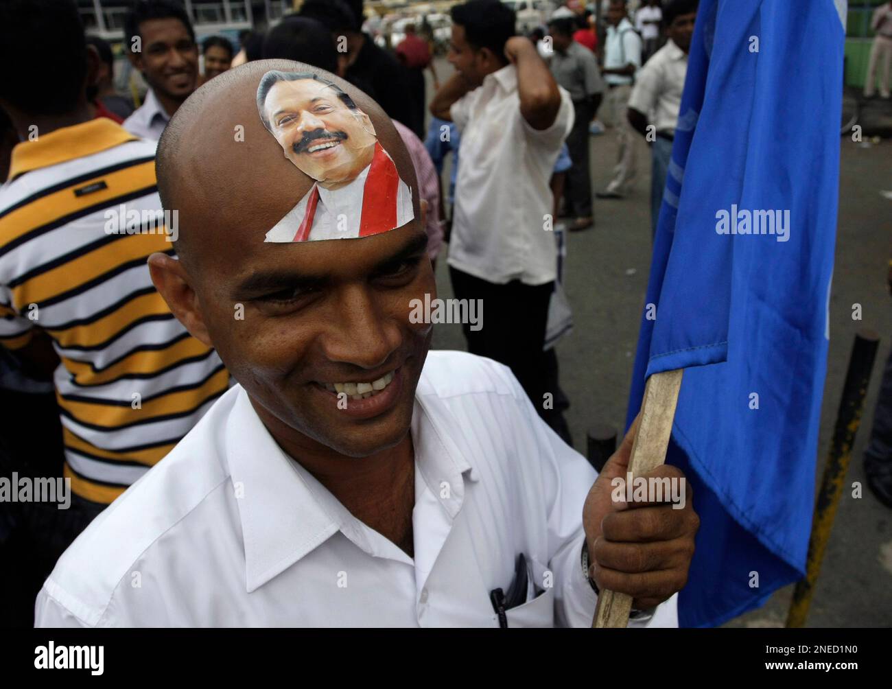 Sri Lankan President Mahinda Rajapaksa's photograph is seen pasted on a ...