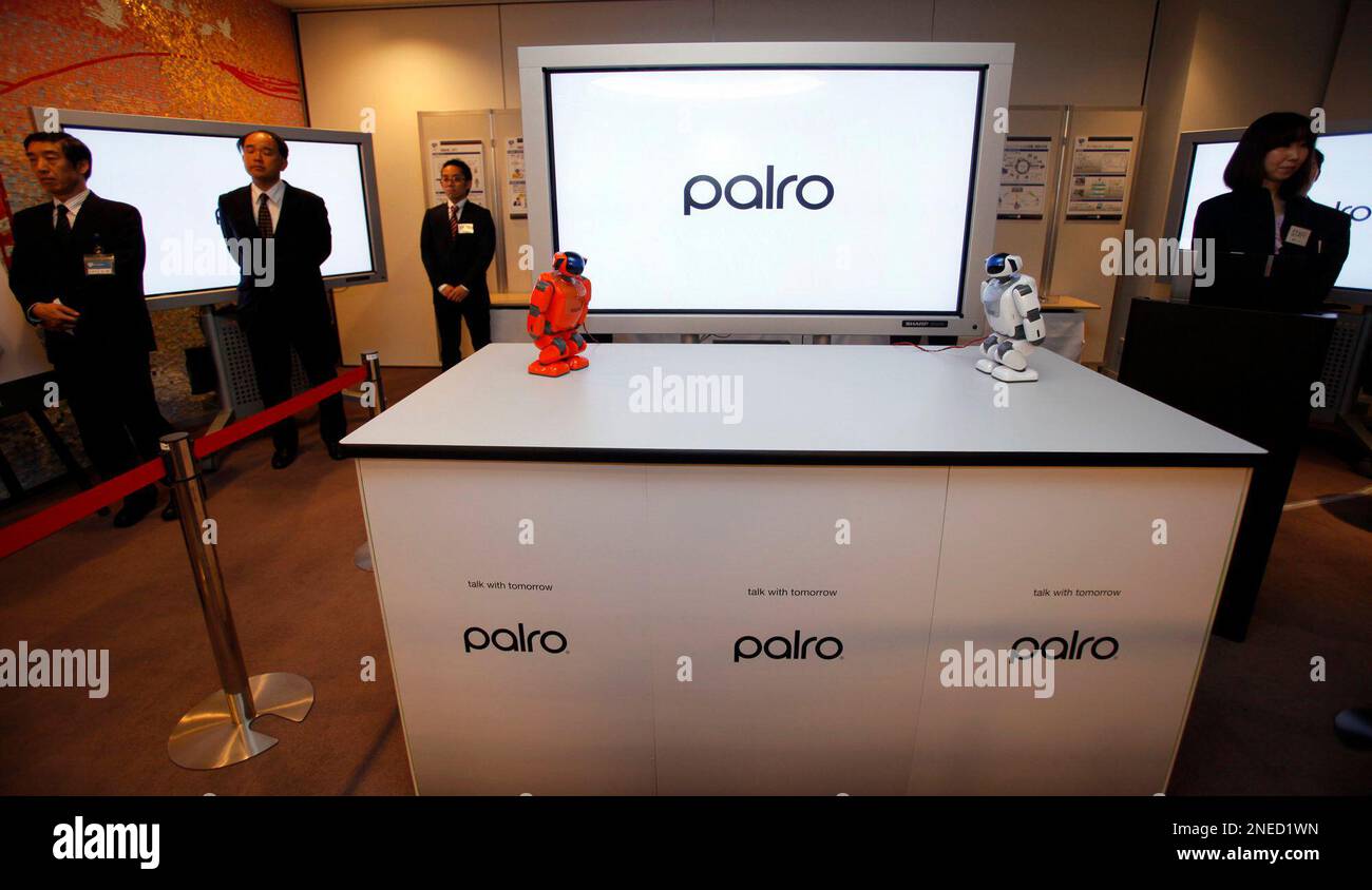 Humanoid communication robots "Palro" are displayed during a press ...